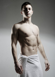 Young man using white towel Royalty-Free Stock Image - Storyblocks