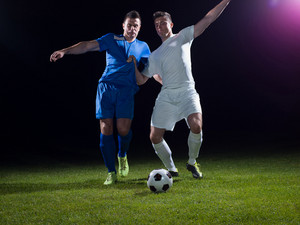 Soccer players duel Royalty-Free Stock Image - Storyblocks