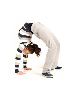 Beautiful young woman makes stretching isolated over white background ...