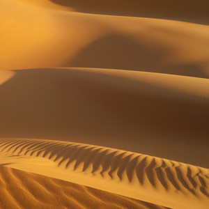 Sunlit sand dunes in the desert Royalty-Free Stock Image - Storyblocks