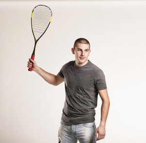 Squash player with racquet isolated on white background Royalty-Free ...