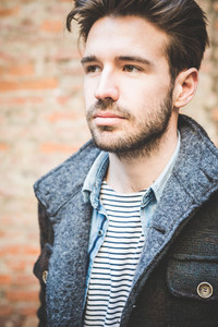 Stylish male model posing outdoors Royalty-Free Stock Image - Storyblocks