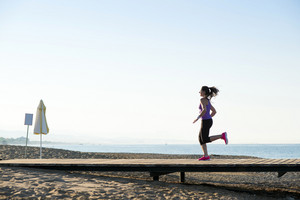 Young woman is running in sunny nature Royalty-Free Stock Image ...