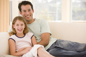 Man and child in living room smiling Royalty-Free Stock Image - Storyblocks