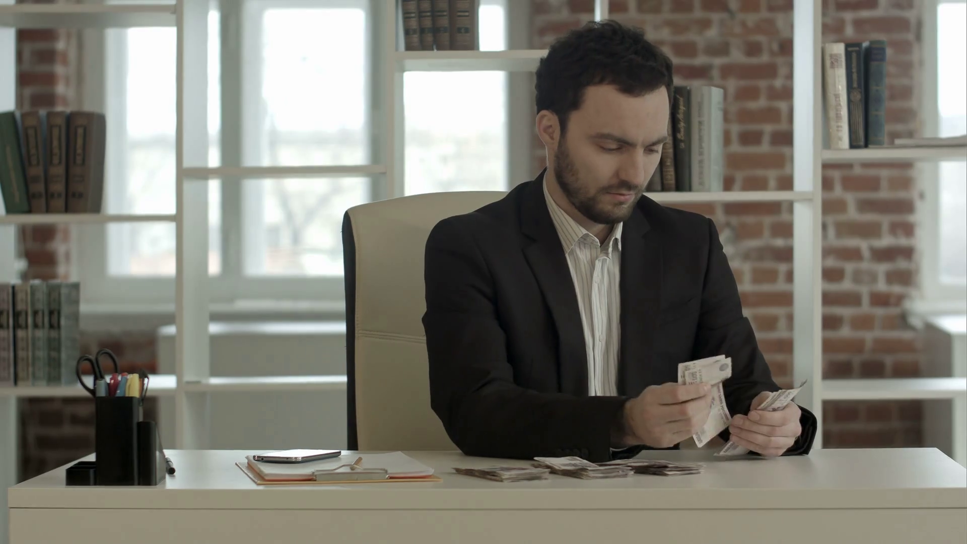 Businessman Counting Out Banknotes Stock Footage SBV-304387149 ...