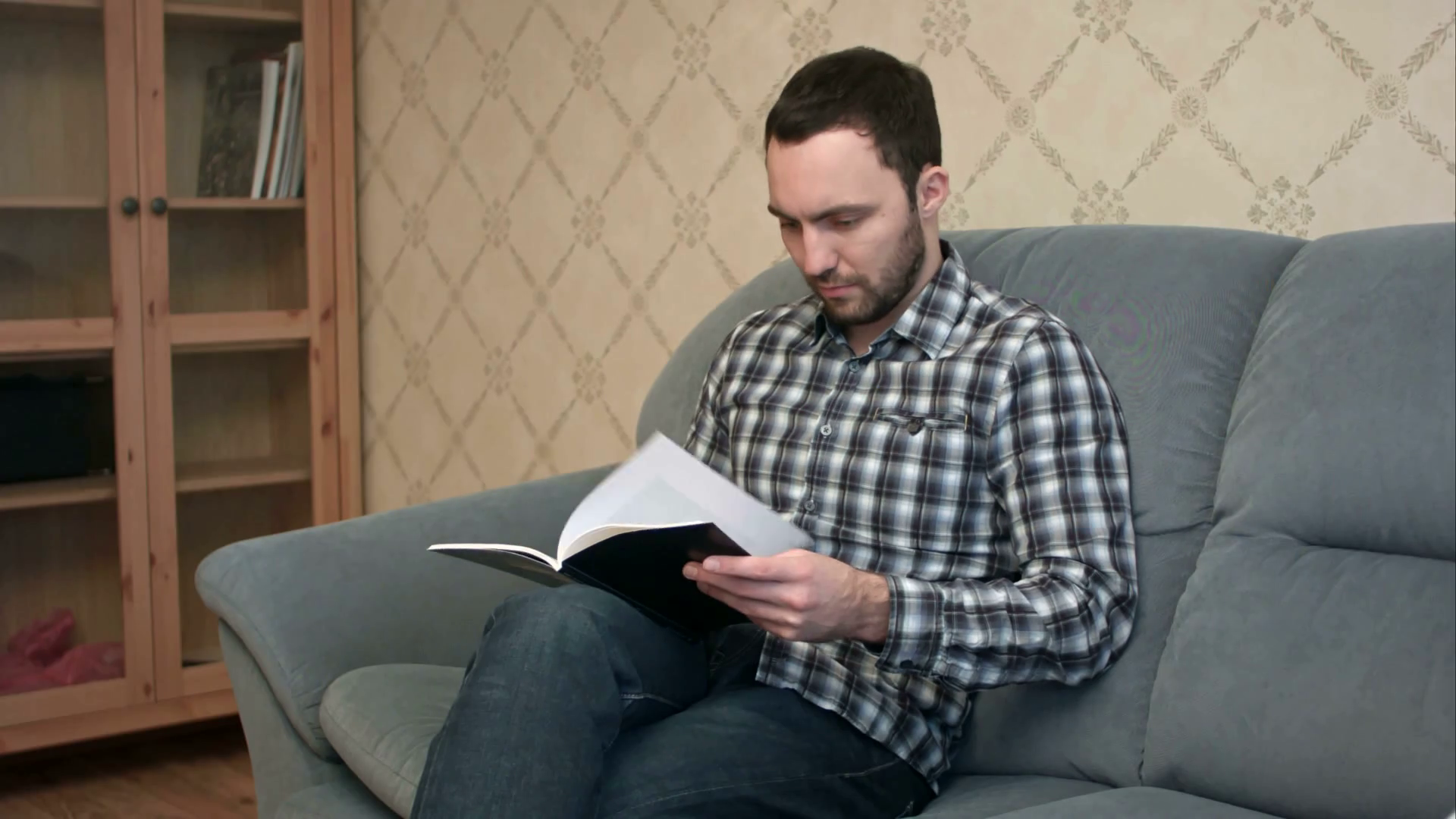 Concentrated Young Man Reading Book Sitting Stock Footage SBV-311916908 ...