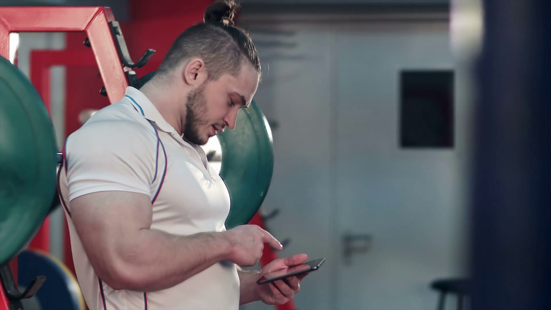 Bodybuilder Using Digital Tablet To Track Stock Footage SBV-313838003 ...