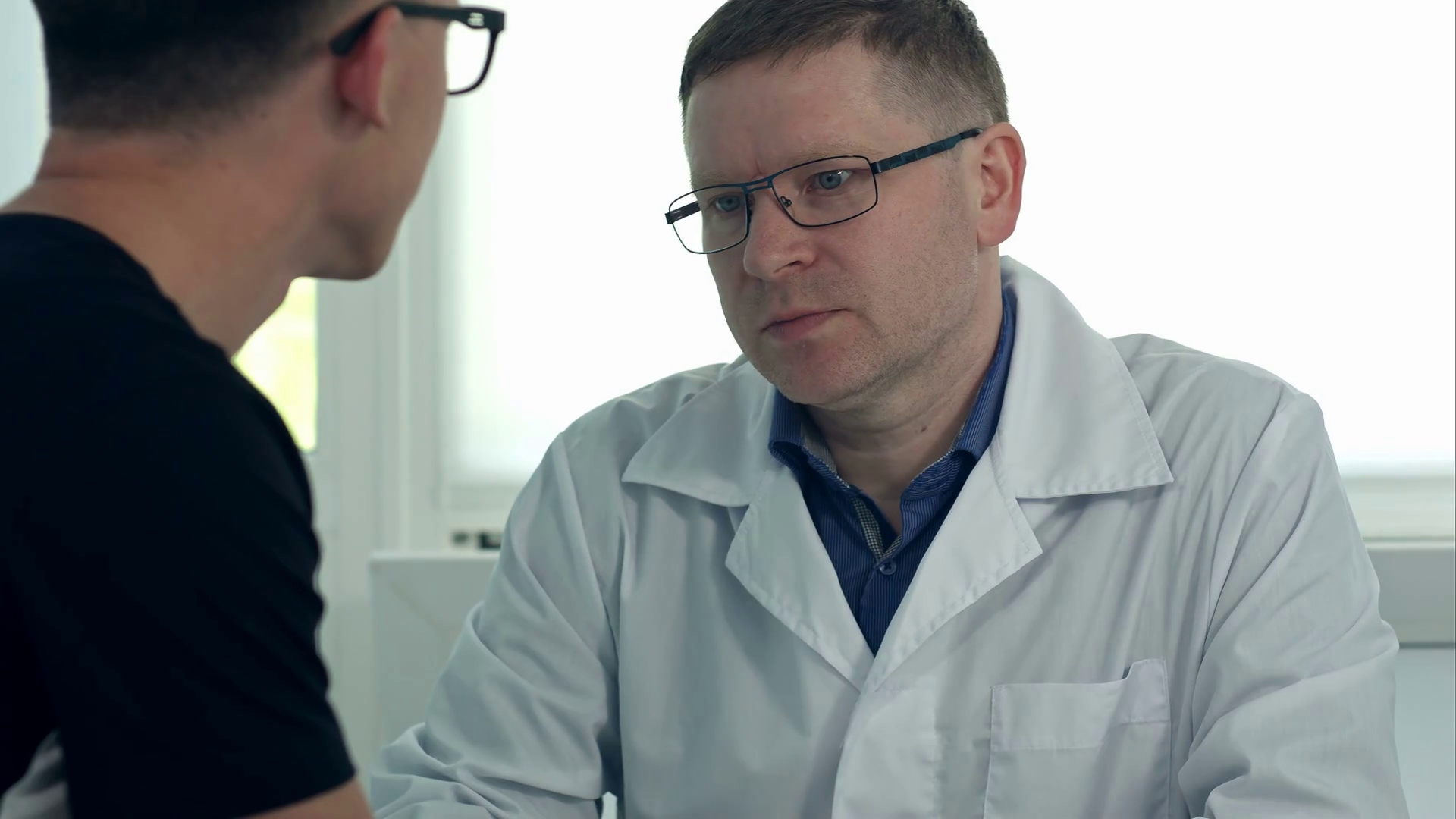 Male Doctor In Glasses Consulting Male Stock Footage SBV-315924210 ...