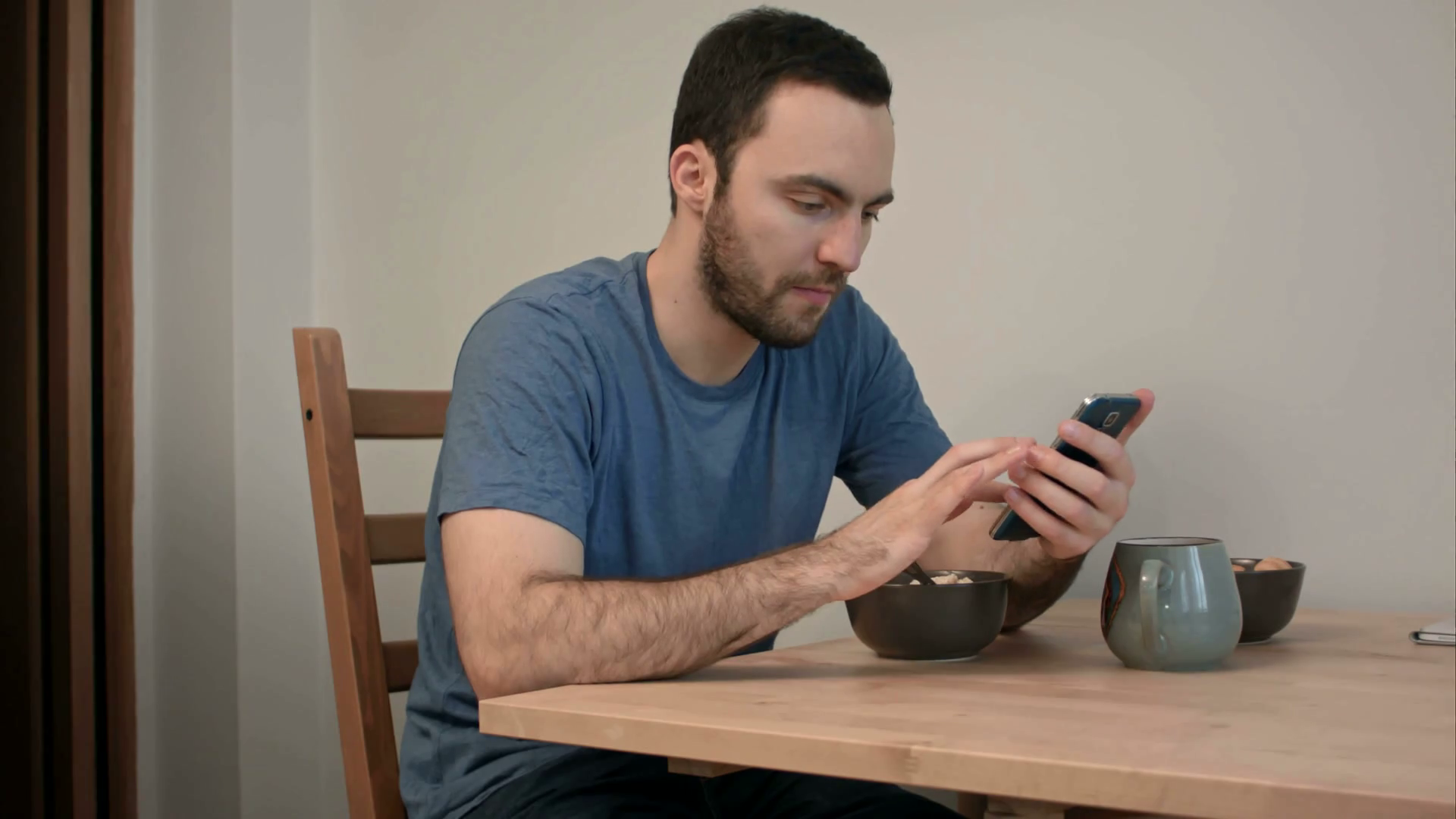 Man Using Phone During Breakfast Stock Footage SBV-311913827 - Storyblocks