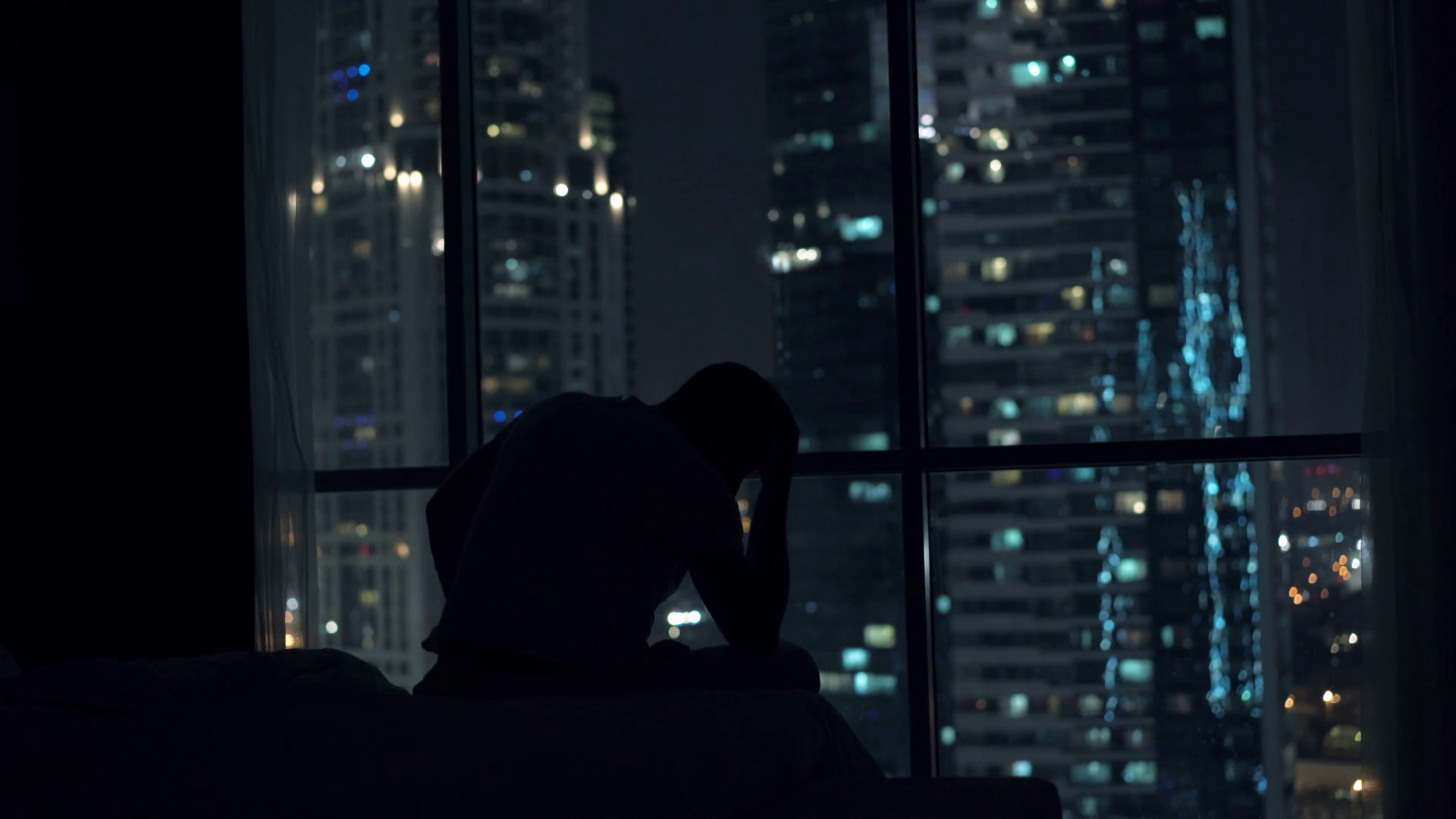 Sad, unhappy man sitting by window during night, 4K Stock Video Footage ...