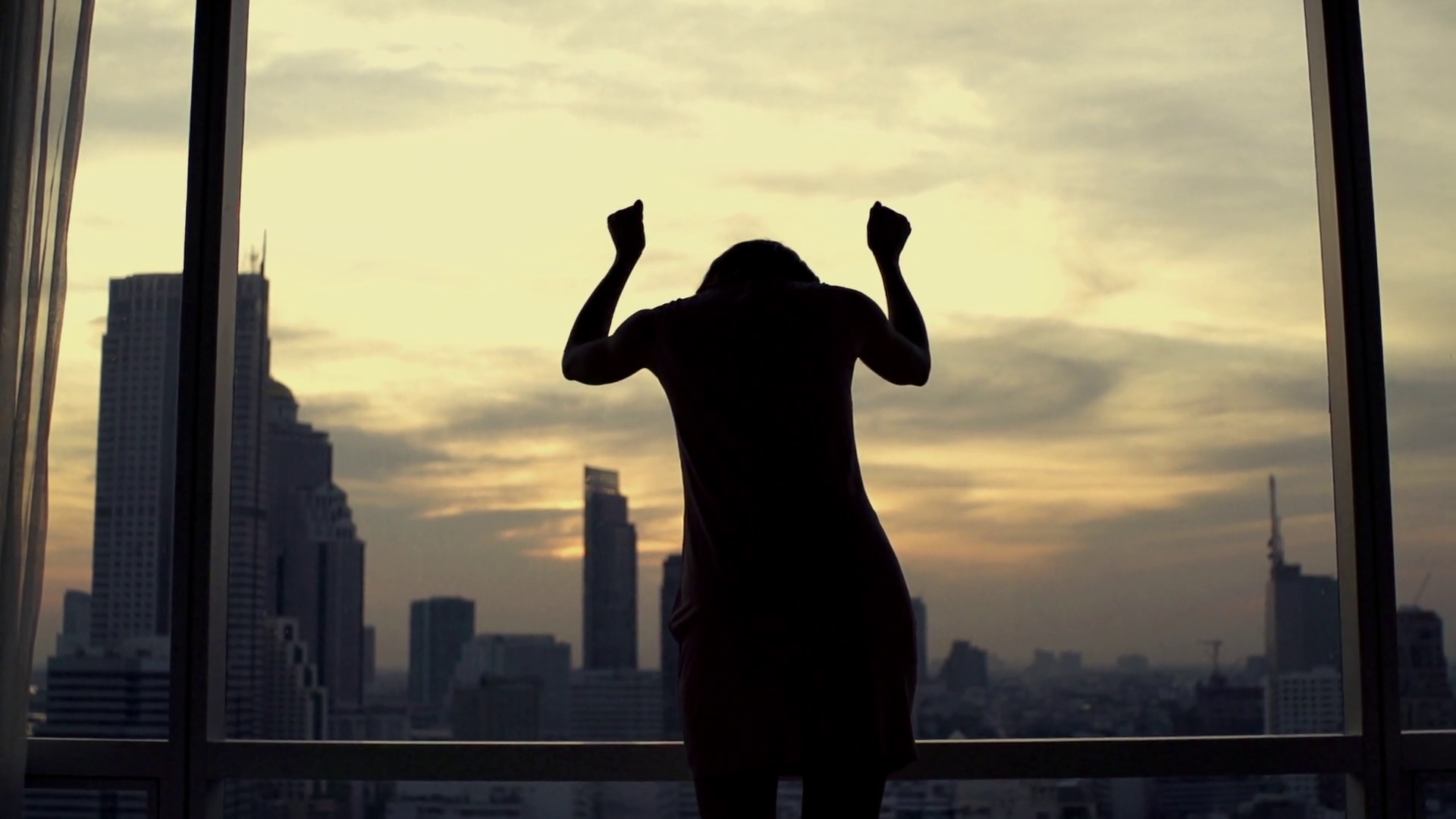 Sad, desperate woman standing by window at home during sunset, super ...
