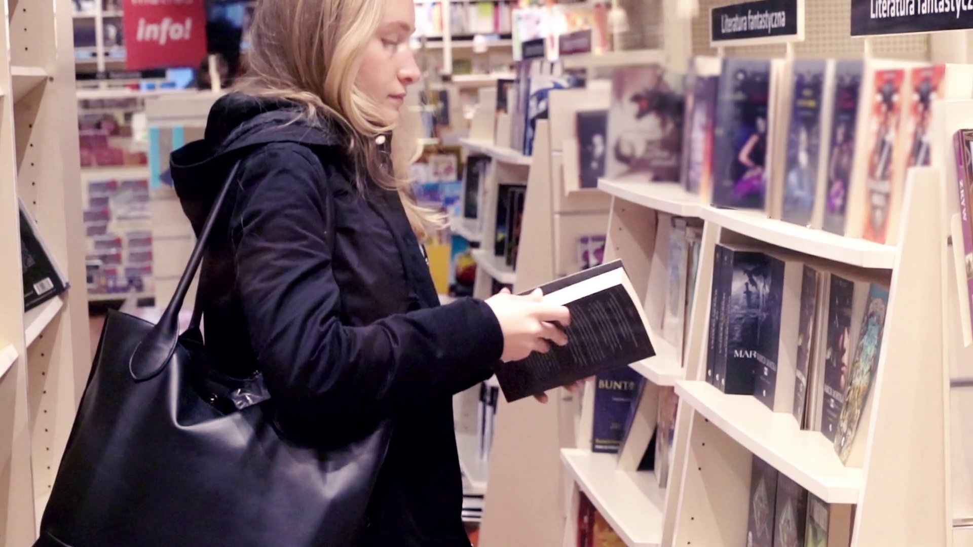 Woman Browsing Books In Bookstore Stock Footage SBV-322028350 - Storyblocks