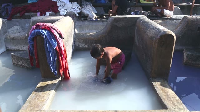 Child Washing Clothes Stock Footage: Royalty-Free Video Clips - Storyblocks