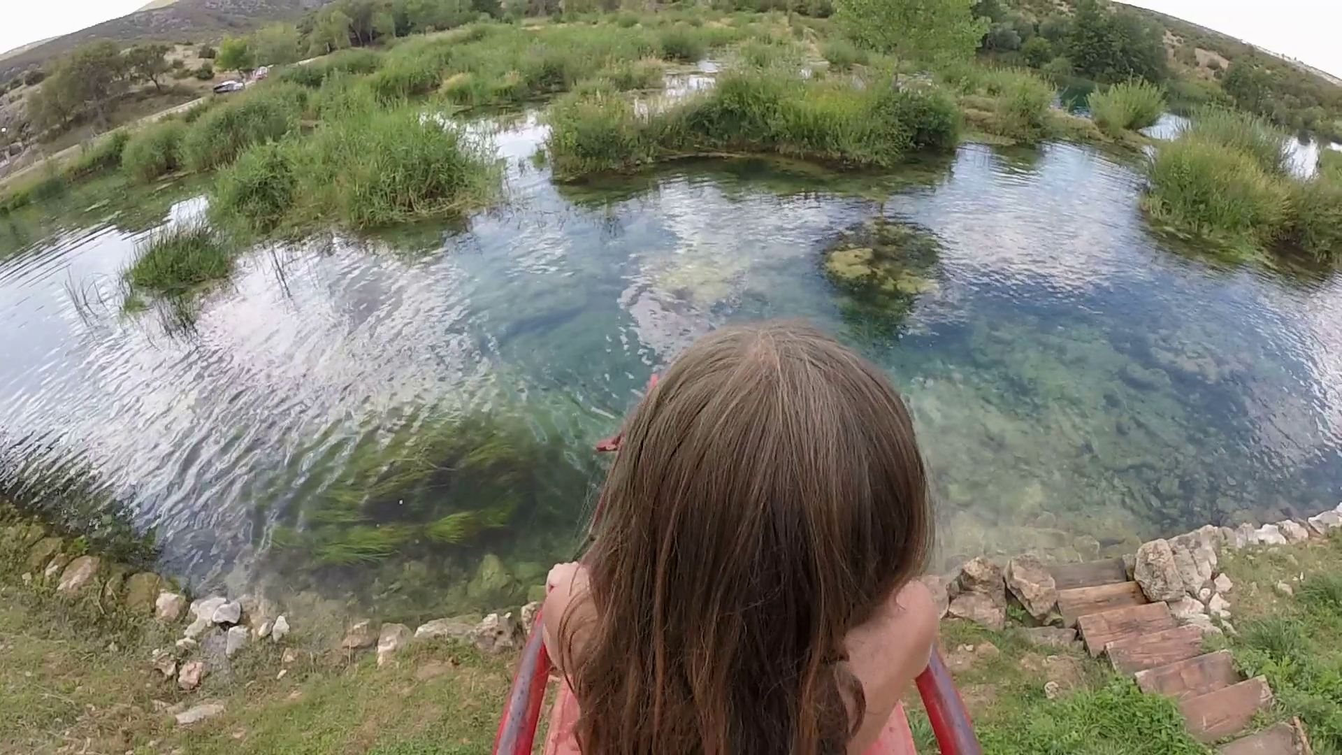 Girl Going Down Slide Into River Stock Footage SBV-314112226 - Storyblocks