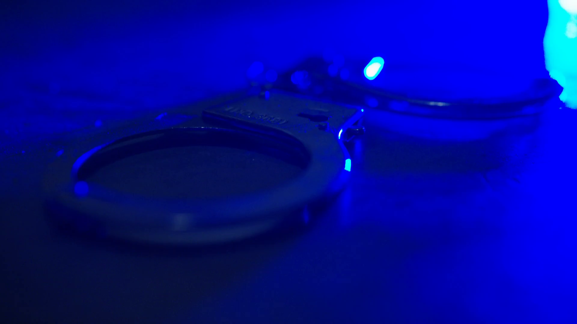 Law Enforcement Hand Cuffs Tilt Up Dynamic Stock Footage SBV-352201055 ...