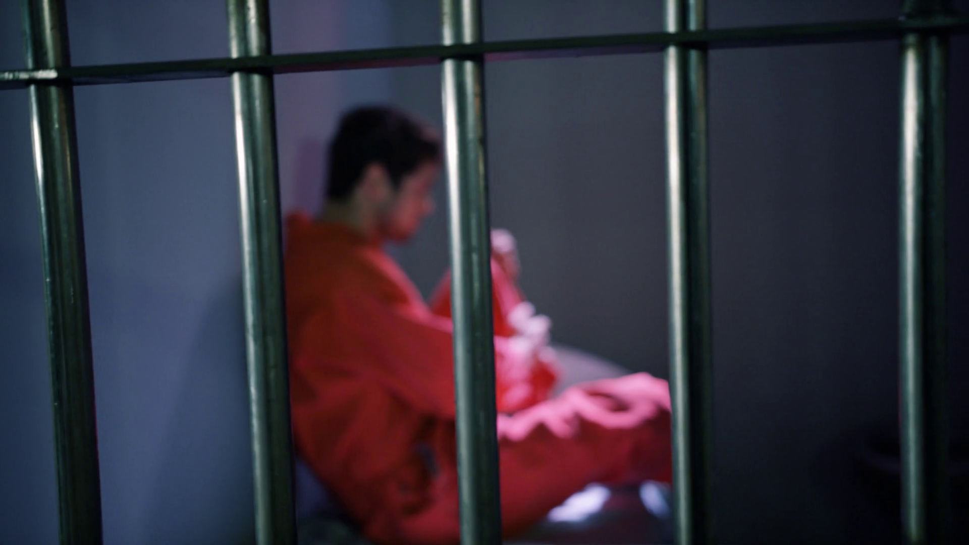 Prison Cells In Jail - Man Huddled On Bed Stock Footage SBV-306862090 ...