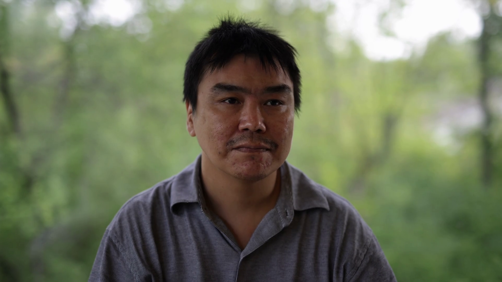 Inuk Man Putting On Over Ear Headphones Stock Footage SBV-348498556 ...