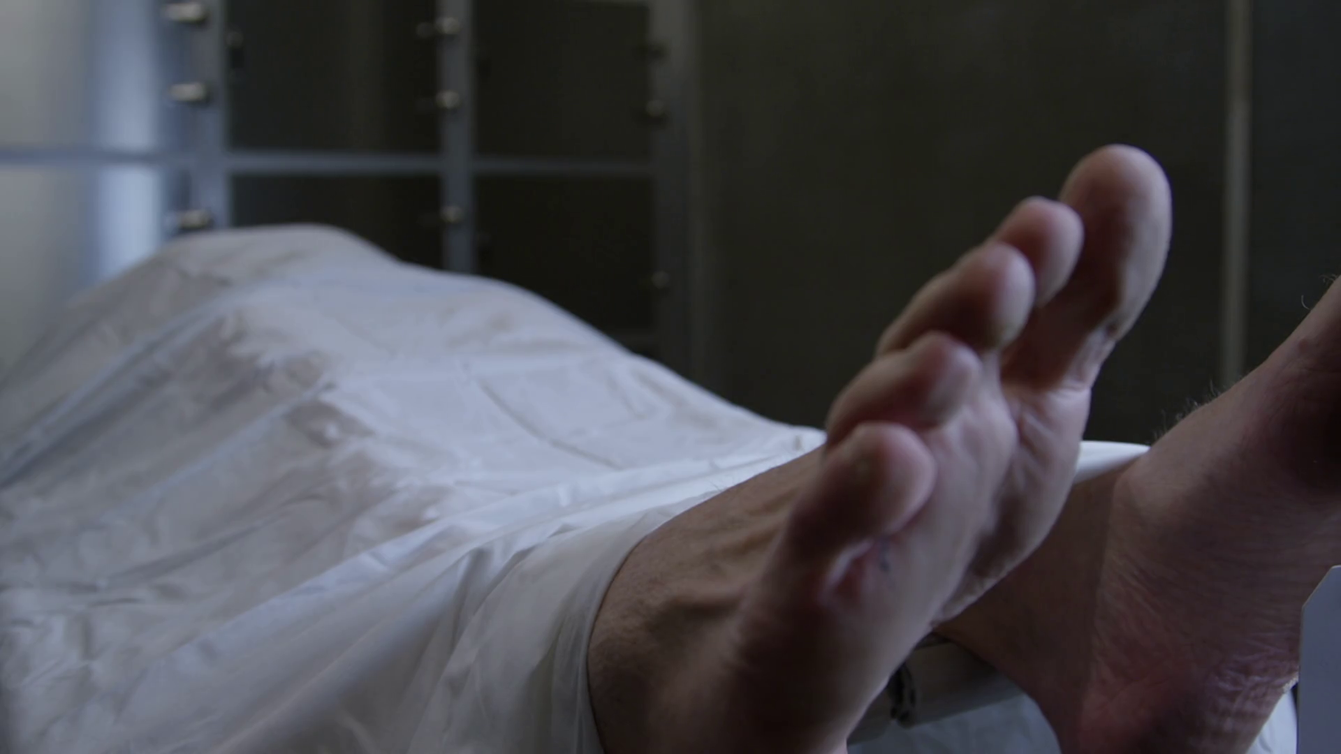 Morgue - Close Up Pan Of Corpse On Gurney To Stock Footage SBV ...