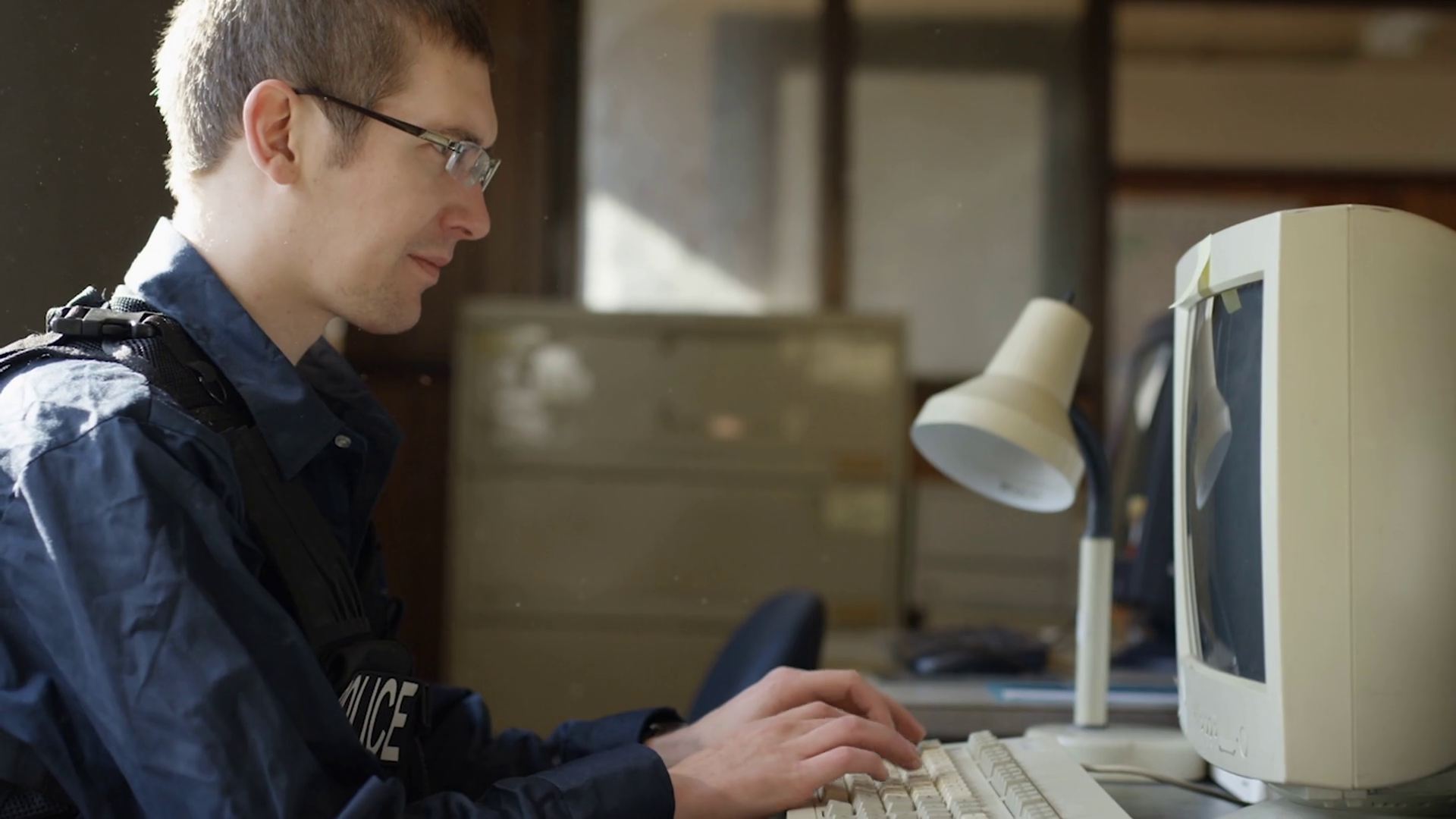 Police Officer Typing On Vintage Computer In Stock Footage SBV ...