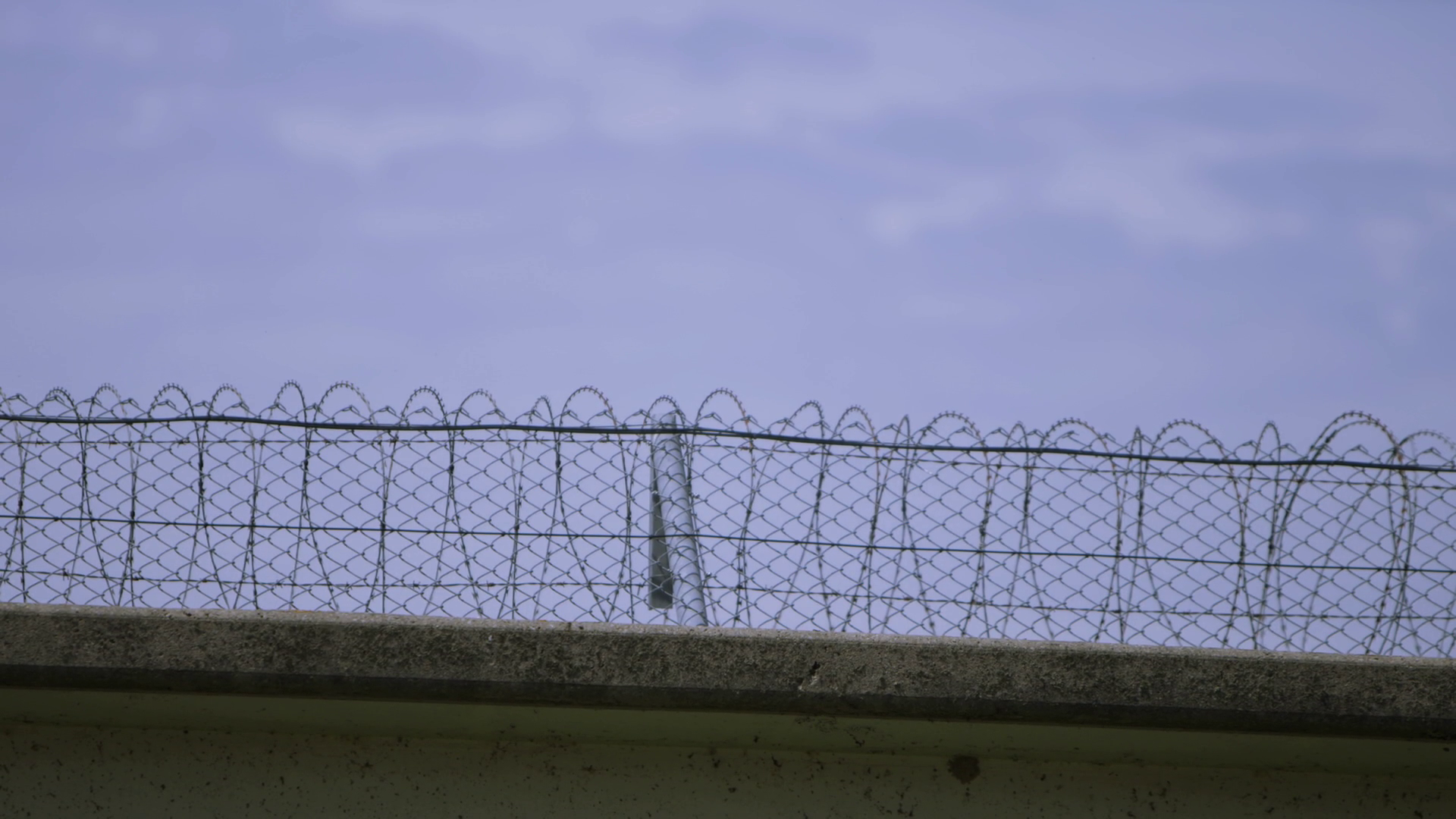 Prison Exterior Tilt Down From Sky To Wall Stock Footage SBV-347719530 ...