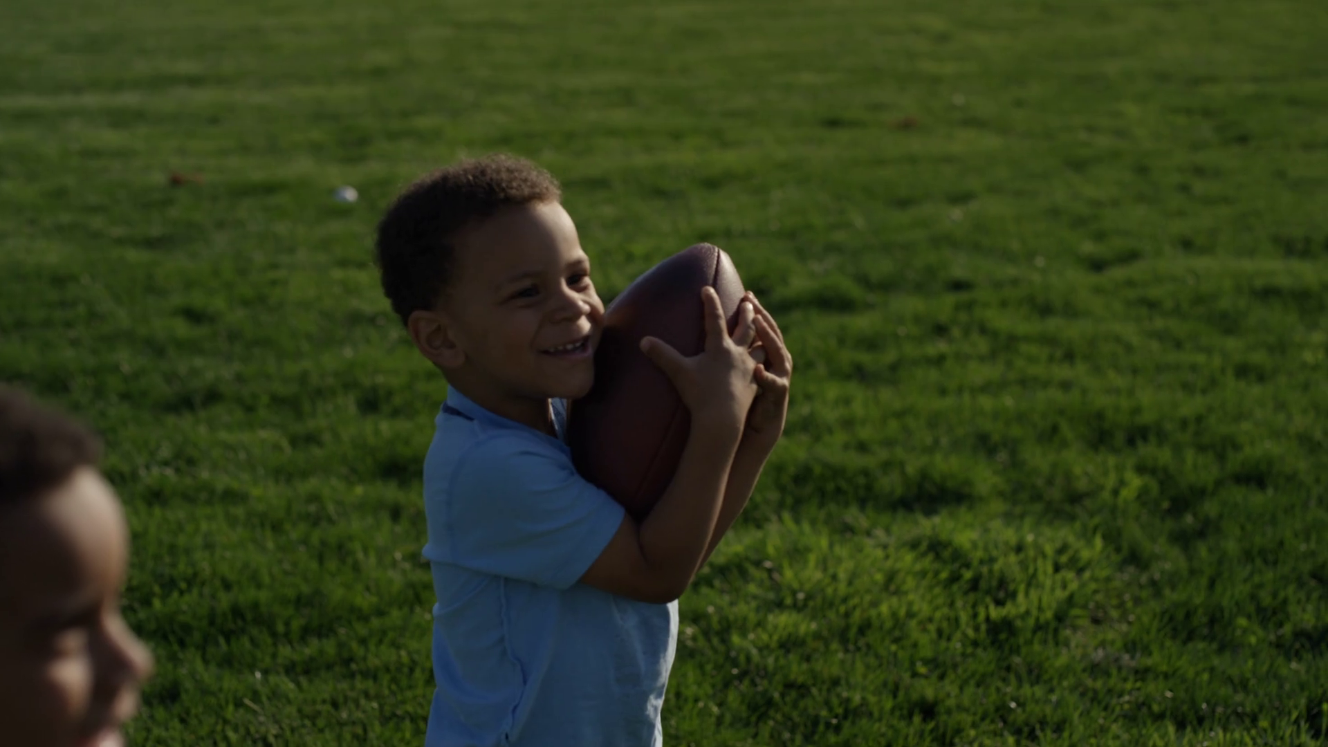 Family Fun: Young Siblings Enjoying Football Stock Footage SBV ...