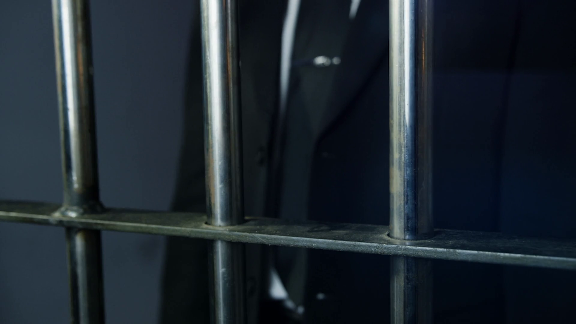 White Collar Crime - Hands On Prison Bars In Stock Footage SBV ...
