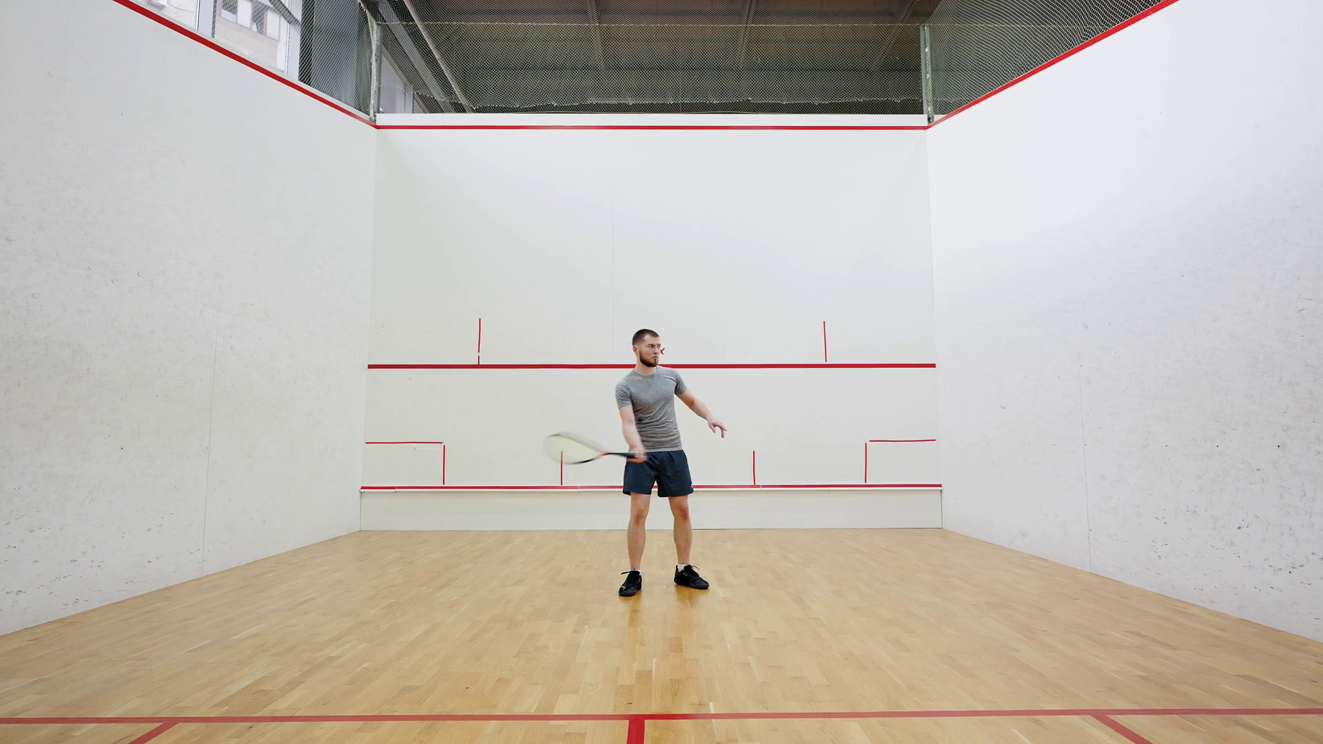 Athlete practices strokes with racket in squash court Stock Video ...
