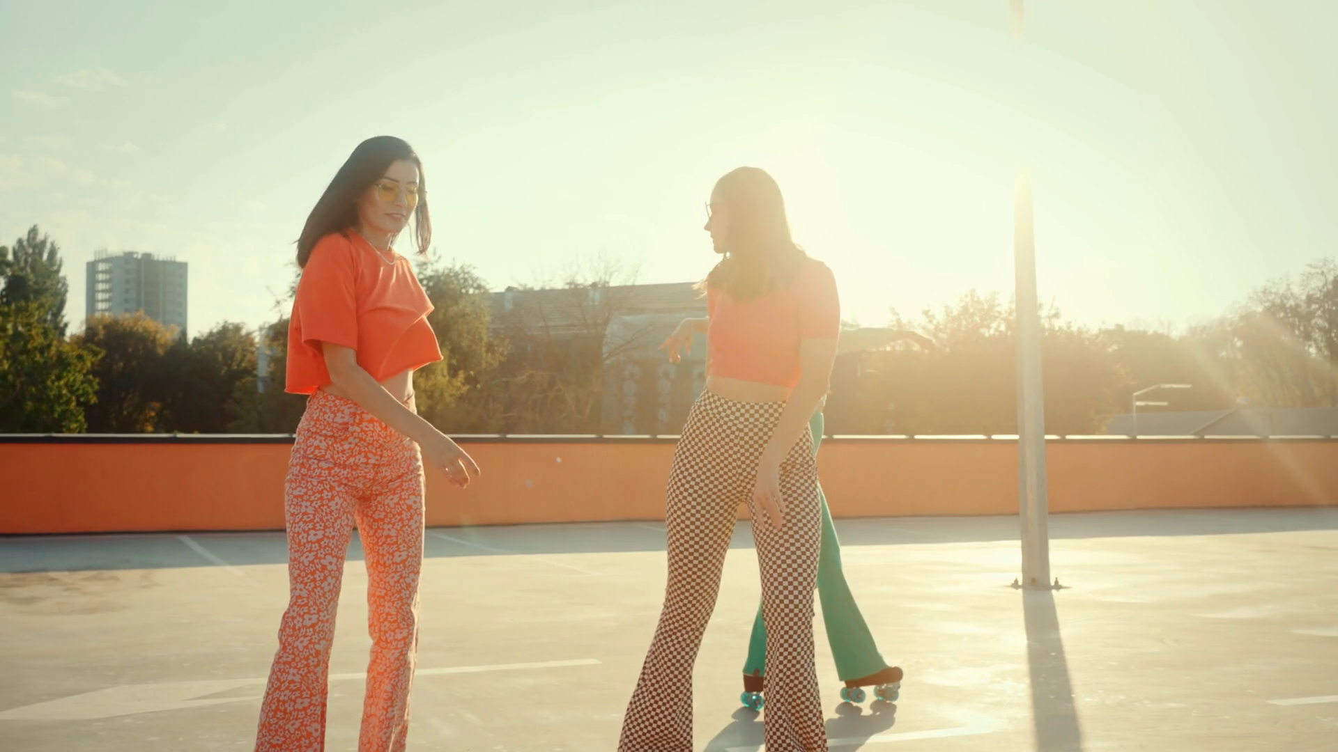 Girls In Bell-bottom Trousers Riding Skates Stock Footage SBV-348606536 ...