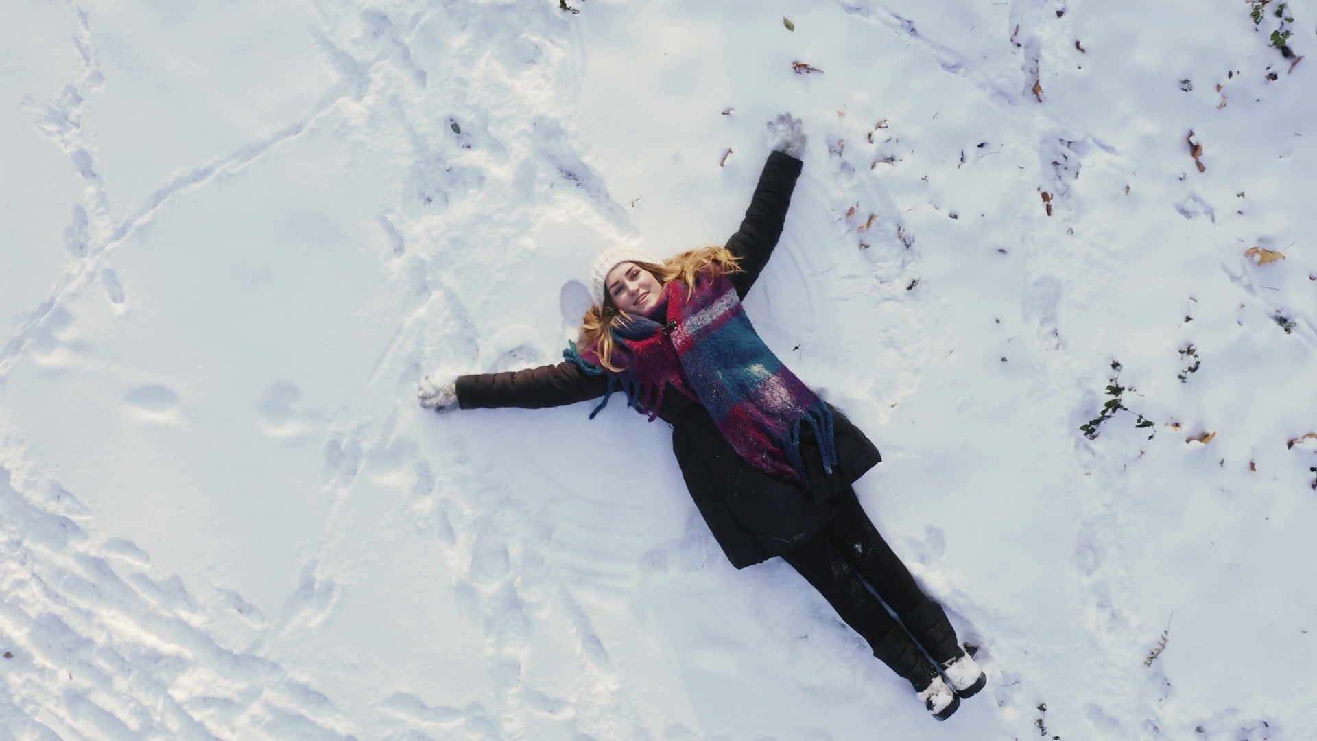 Joyful Woman Creating Snow Angel Aerial View Stock Footage SBV ...