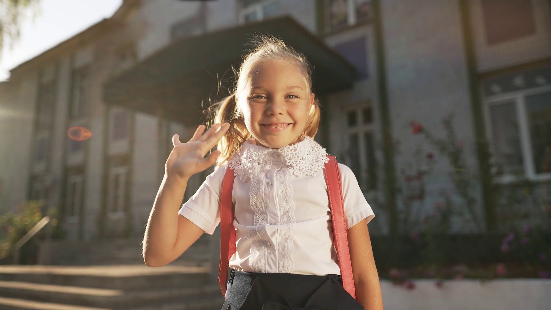 Smiling Little Girl Waving In Front Of School Stock Footage SBV ...