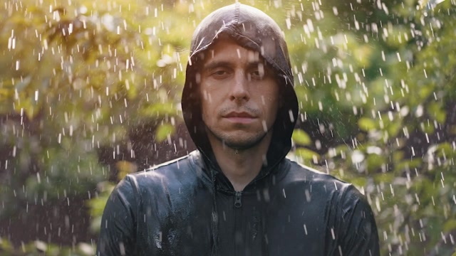 Man Standing In The Rain Stock Footage: Royalty-Free Video Clips - Storyblocks