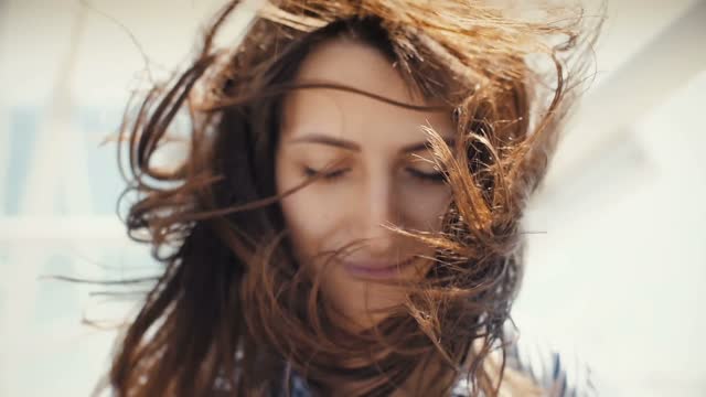 Woman Hair Blowing In Breeze Stock Footage: Royalty-Free Video Clips ...