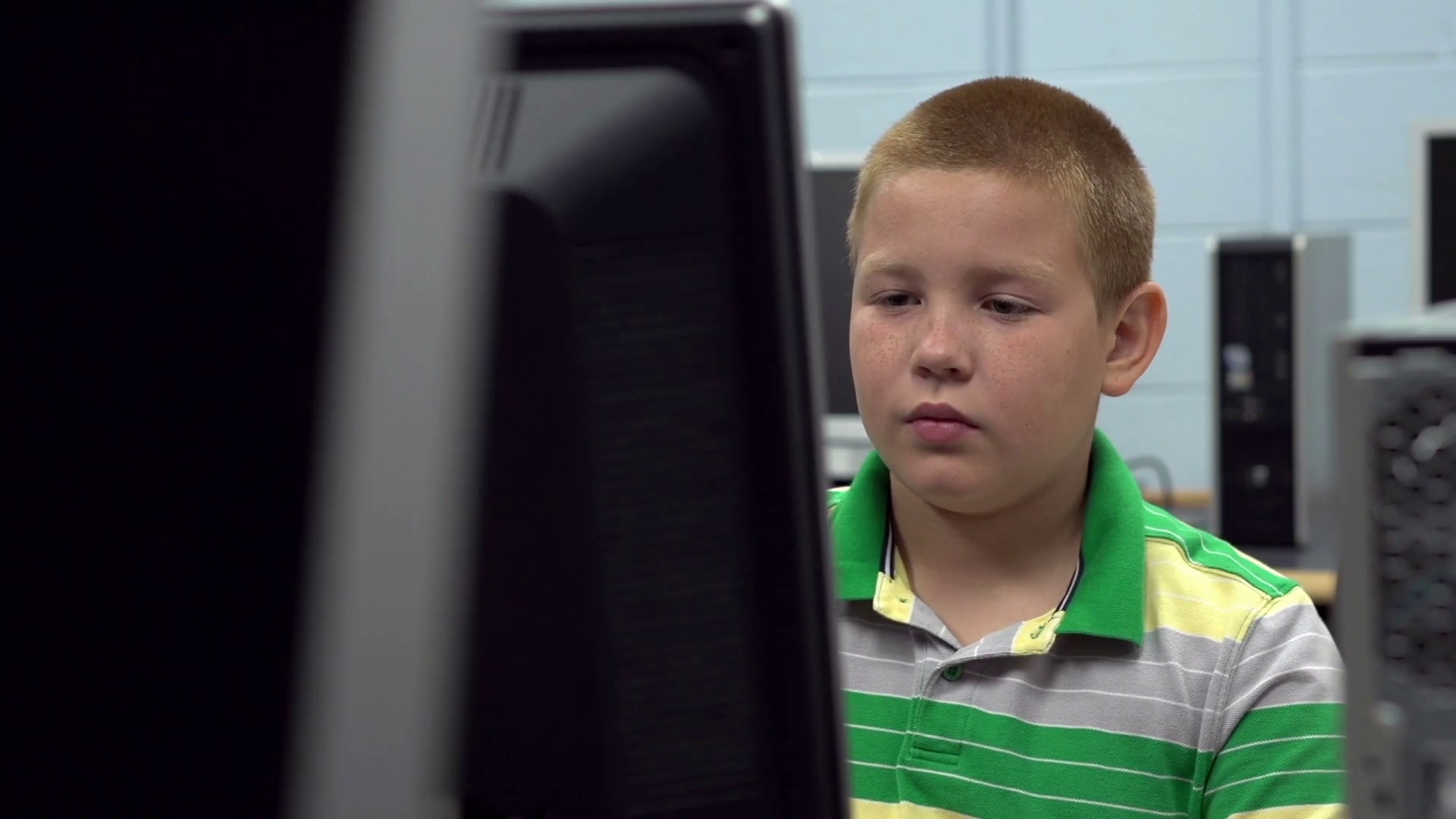 Boy smiling while using computer lab at school Stock Video Footage 00: ...