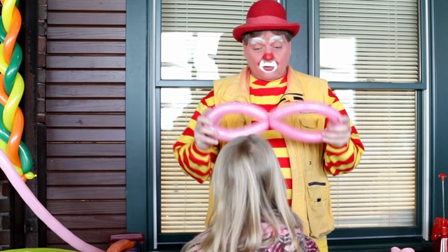 Clown Helping Child Cope With Hospital Stock Footage: Royalty-Free ...