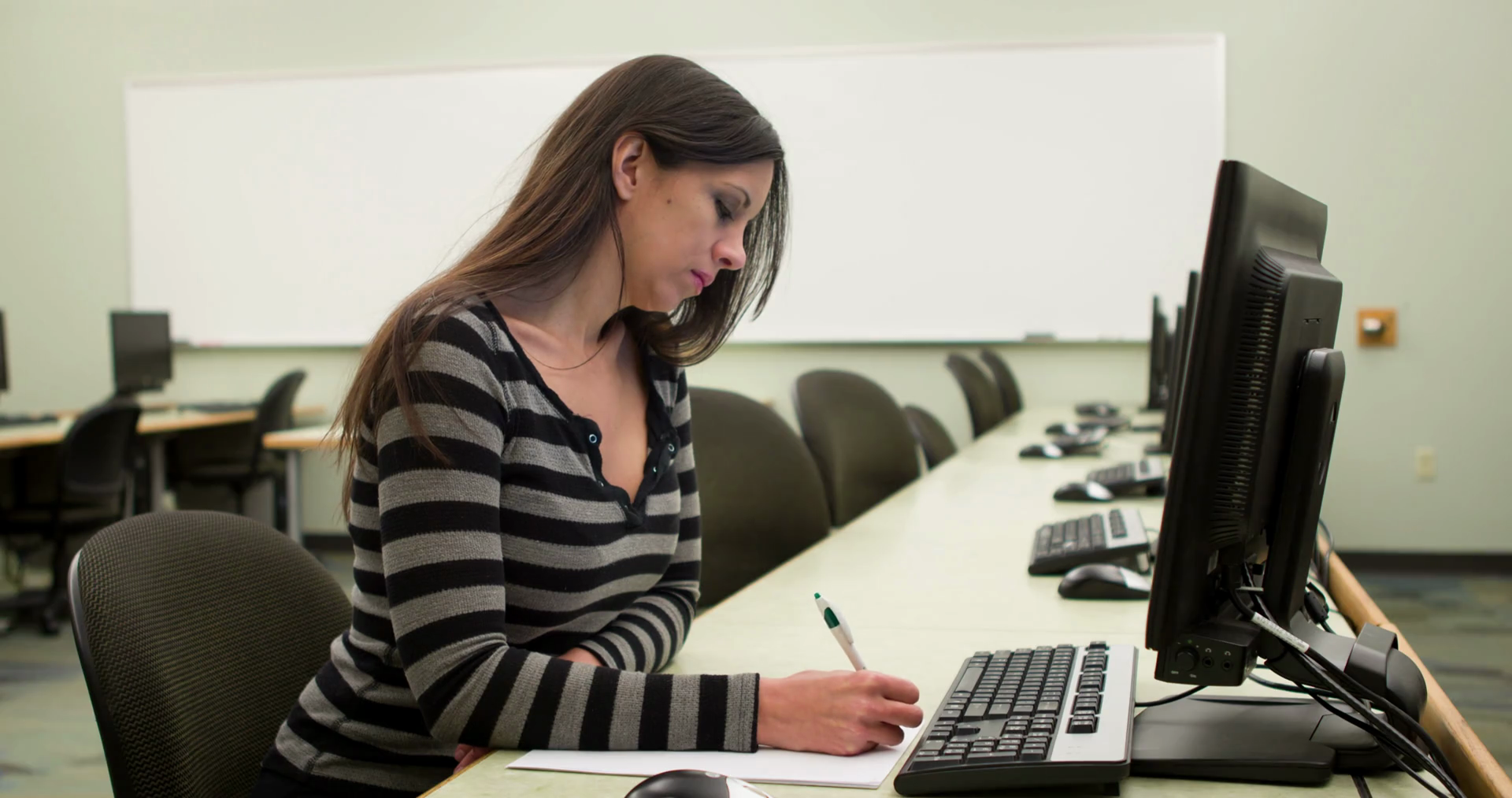 Female Working At Computer Lab Desk Writing Stock Footage SBV-300226230 ...