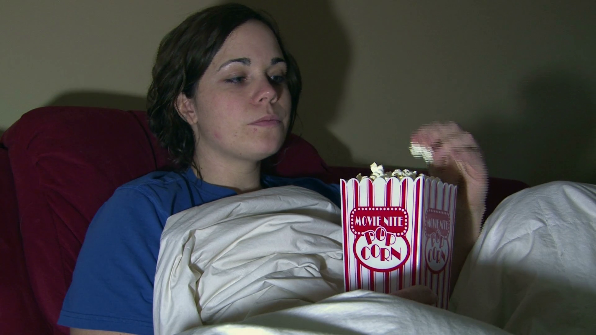 Girl Watching Tv Eating Popcorn Stock Footage SBV-300817772 - Storyblocks