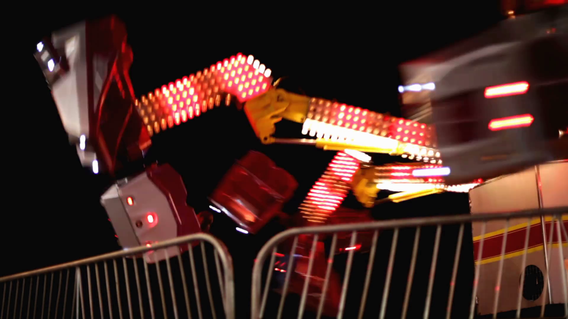 Scrambler Carnival ride at Night behind fence Stock Video Footage 00:14 ...