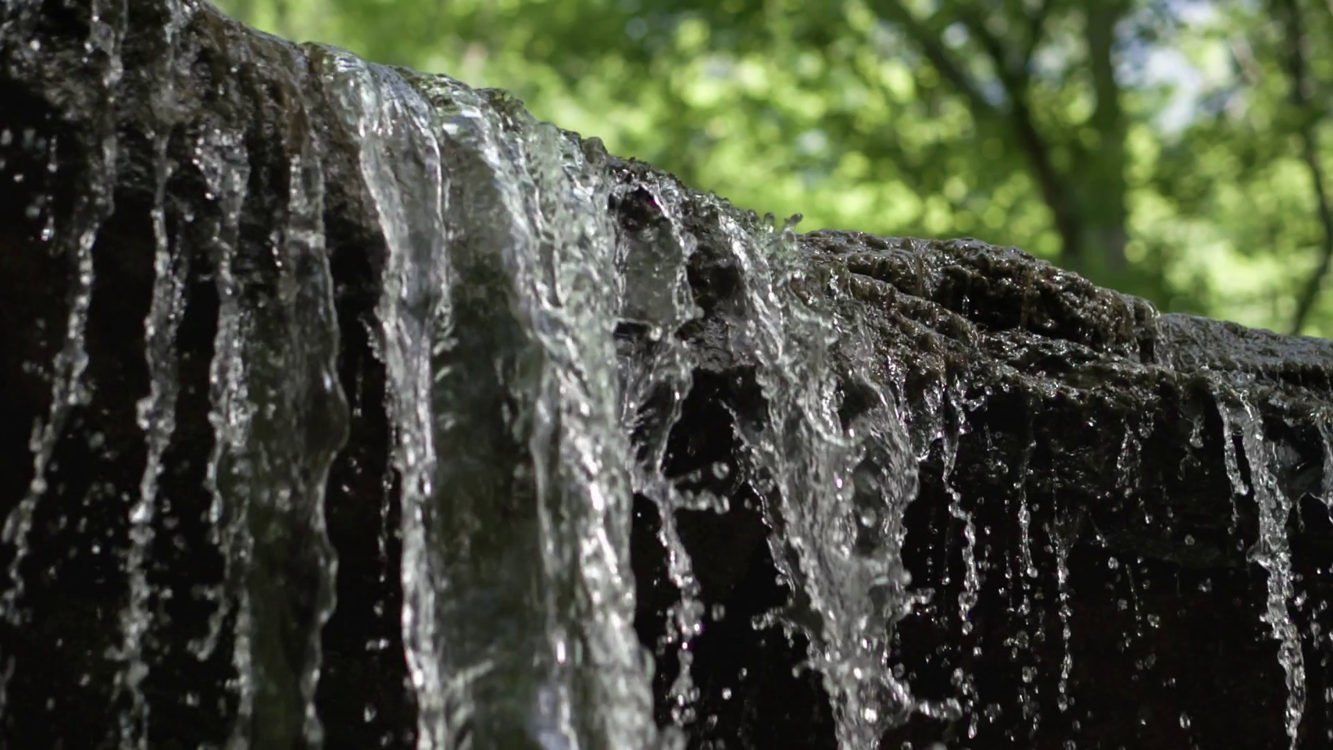 Stream Of Water Falling Over Rock Edge Slow Stock Footage SBV-301474709 ...