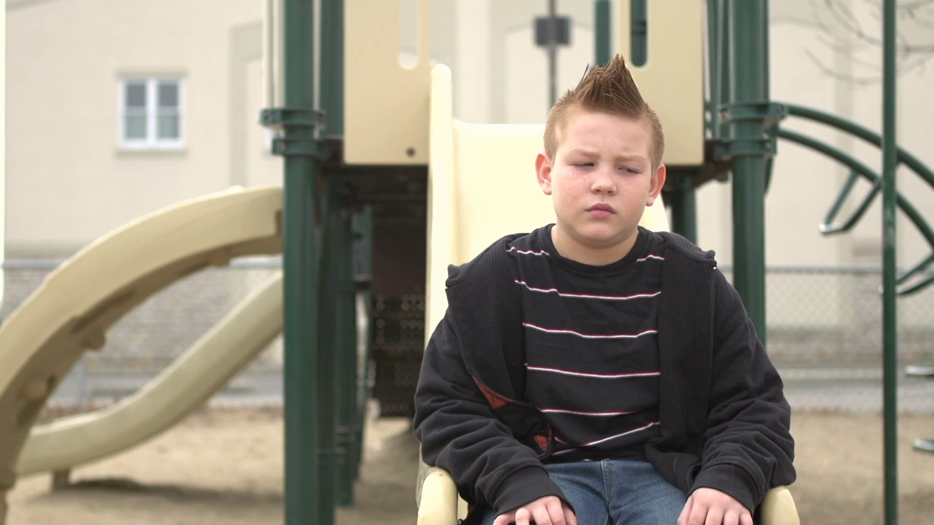 Upset Boy Sitting On Slide Stock Footage SBV-301151420 - Storyblocks