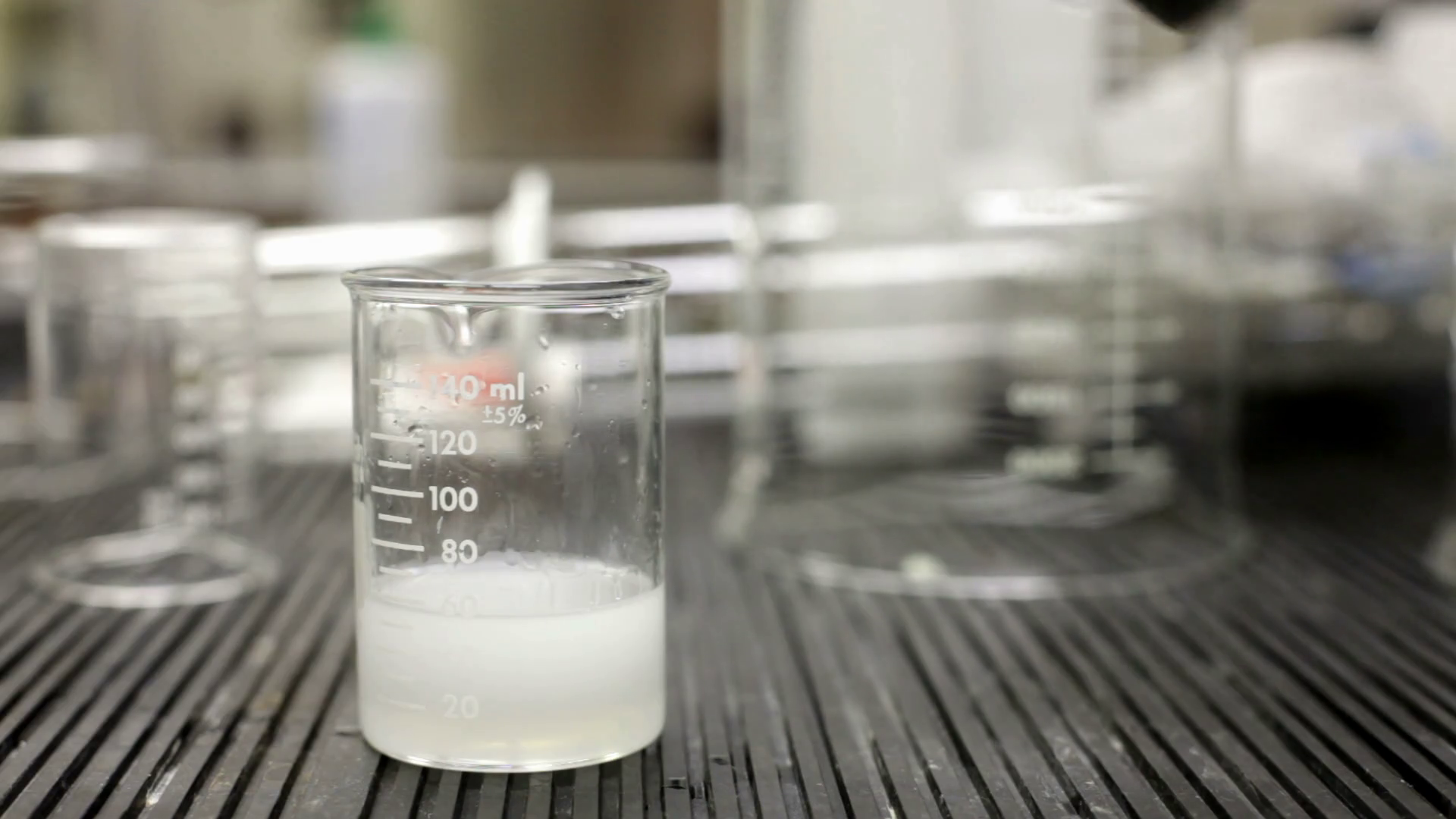 Using Syringe To Remove Water From Beaker Stock Footage SBV-301082794 ...