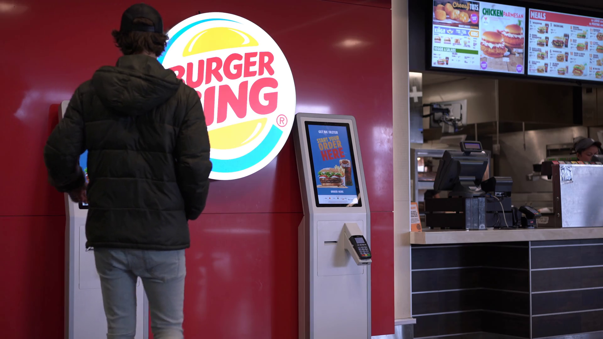 Man Using Automated Ordering Kiosk At Burger Stock Footage SBV ...