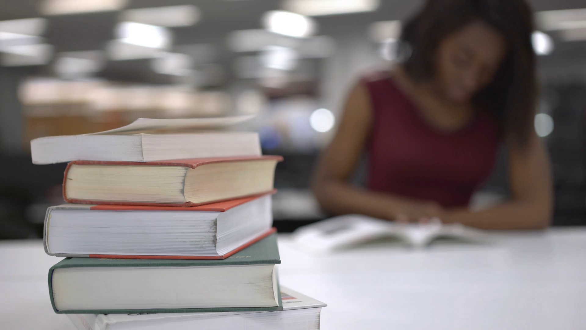 Stack Of Books In Library With Student In Stock Footage SBV-337702153 ...