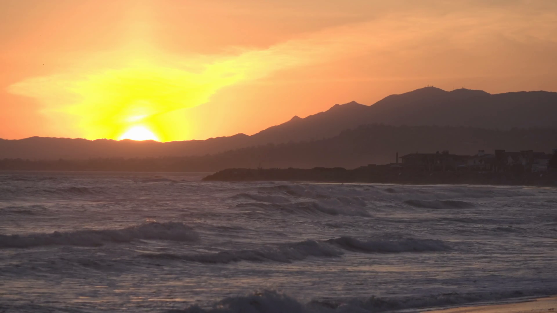 Sunset Behind Mountains With Ocean Waves Stock Footage SBV-324063020 ...