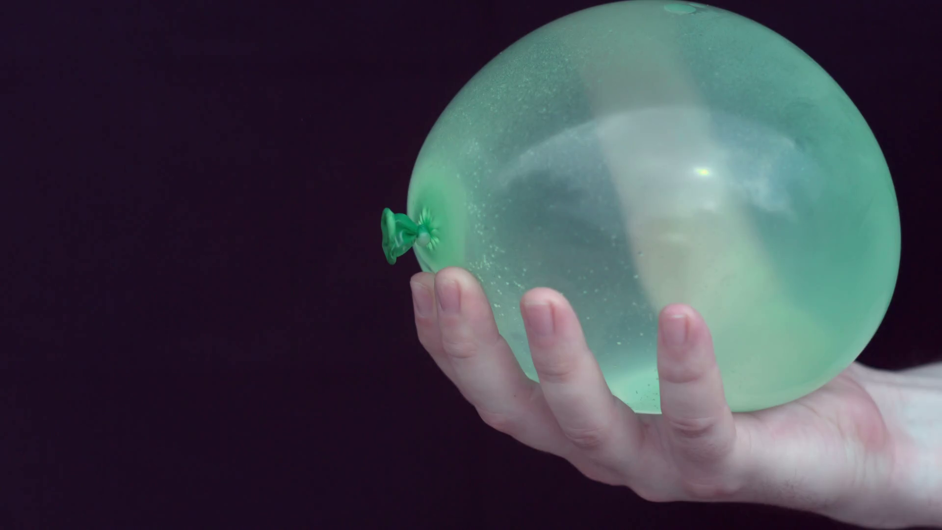 Water Balloon Burst In Hand Stock Footage SBV-301110220 - Storyblocks