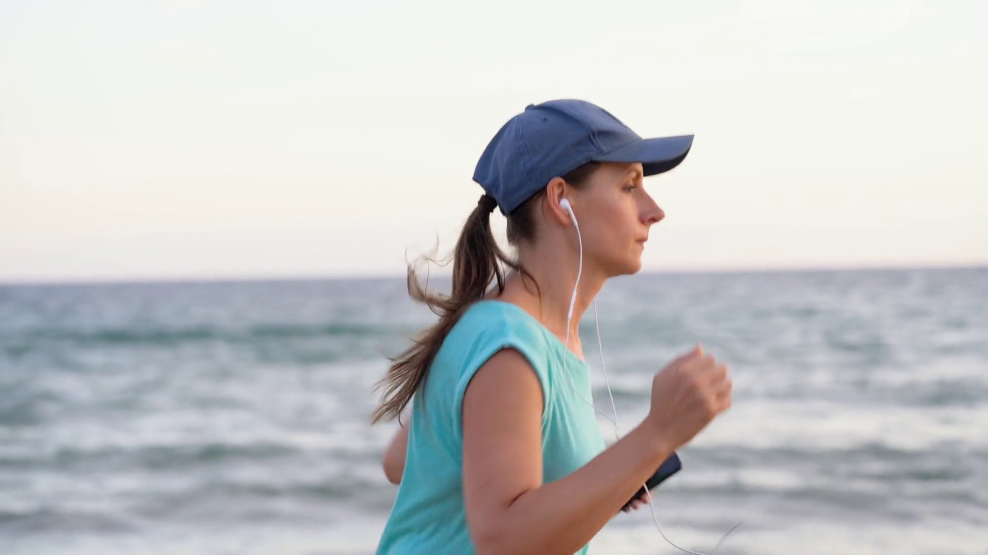 Athletic Woman Running Along Beach Slow Stock Footage SBV-319051929 ...