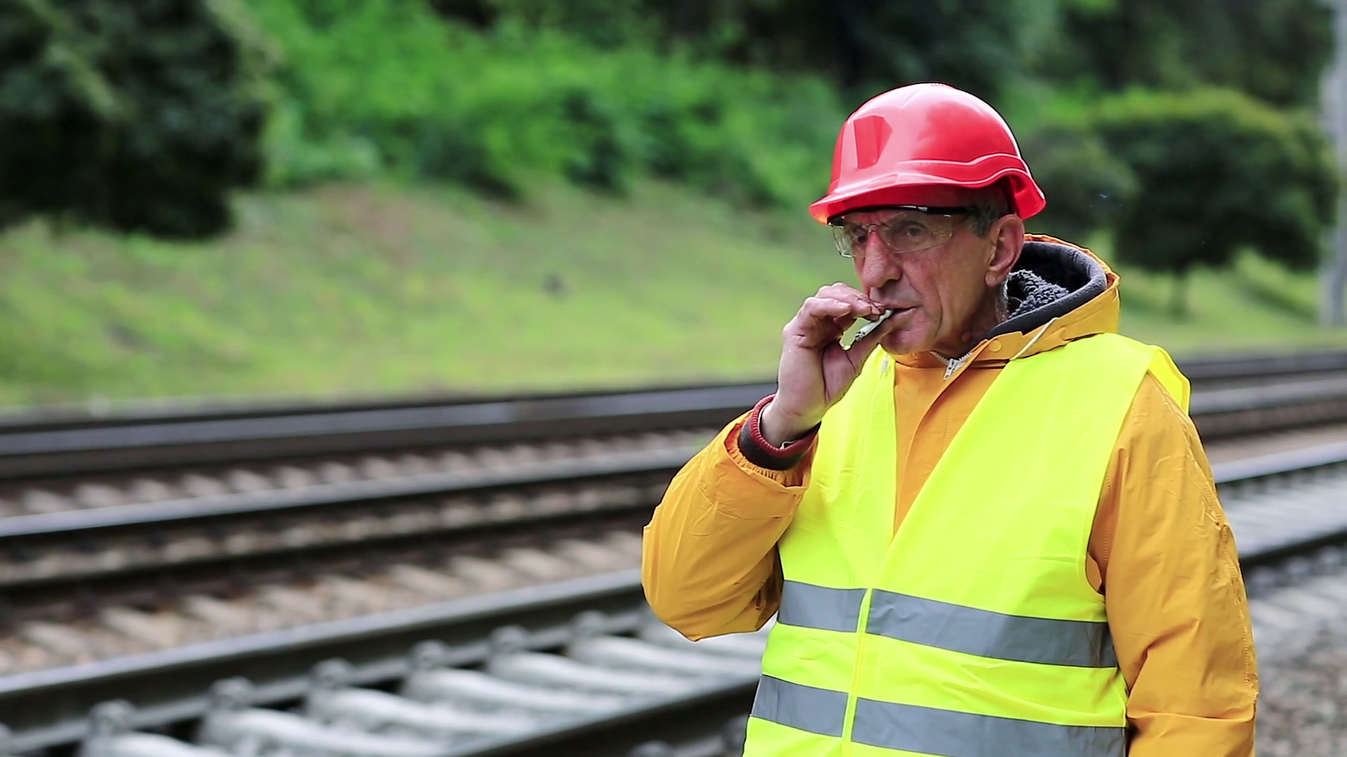 Railway Worker In Yellow Uniform Stands On Stock Footage SBV-312257302 ...