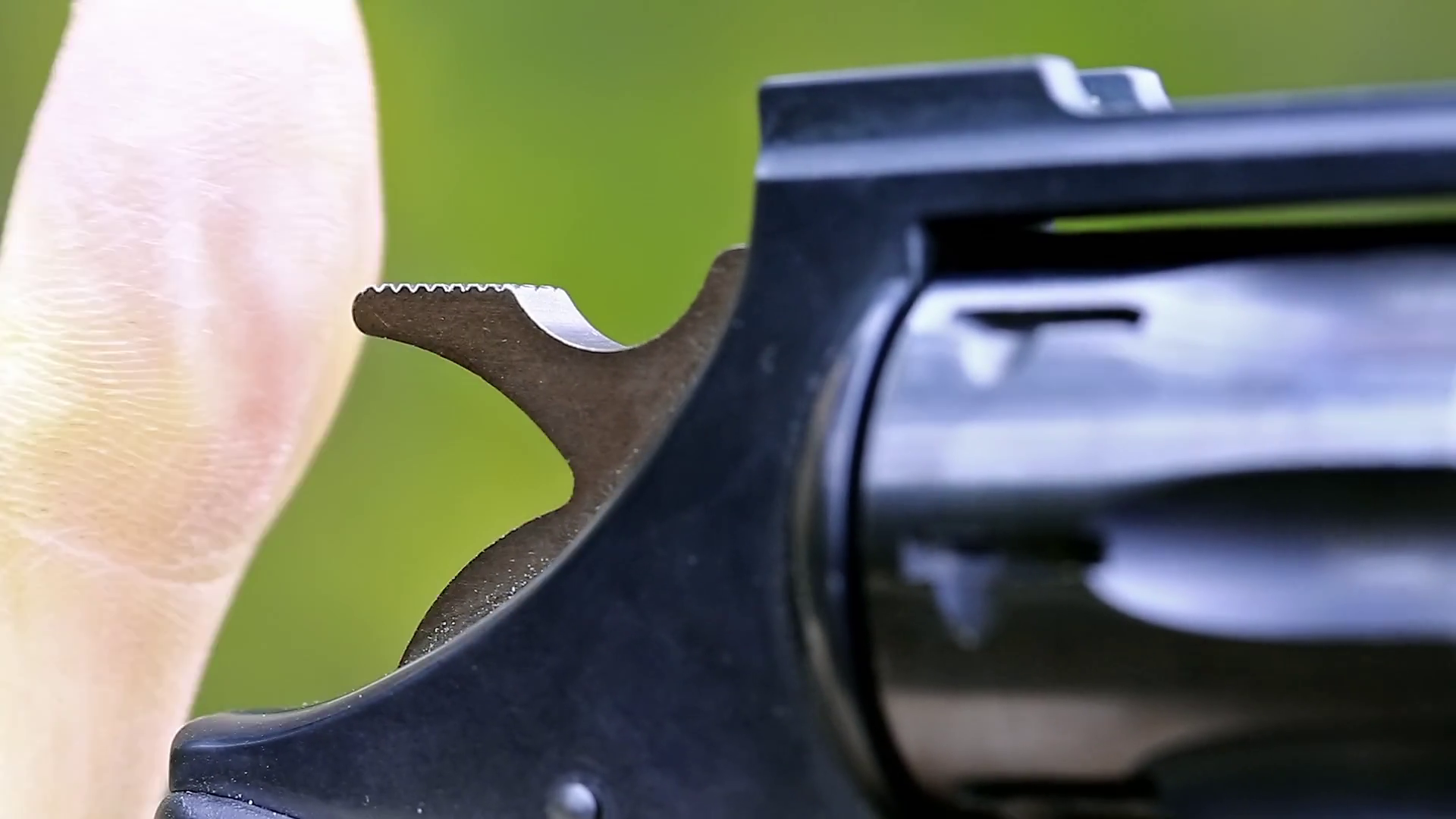 Shots from a revolver. Man shoots a revolver. Shots from a black pistol ...