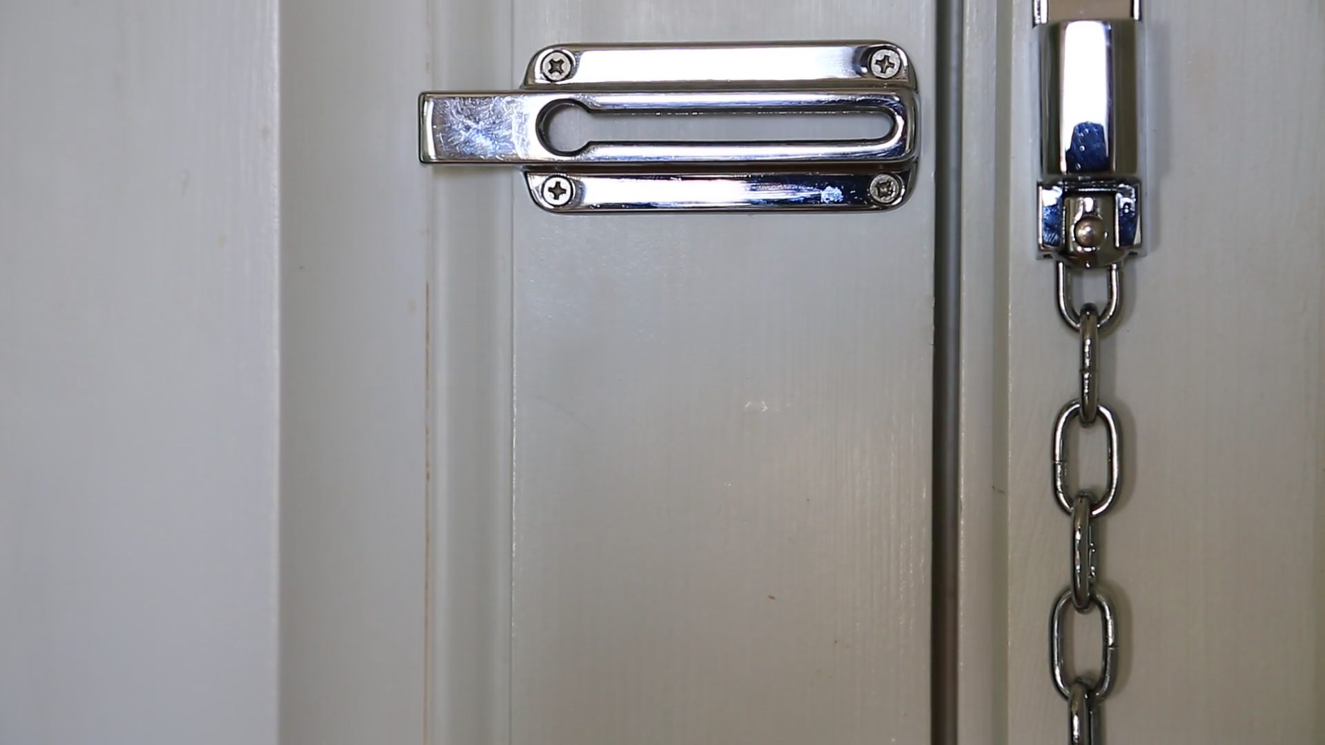 Woman Closes Door To Safety Chain Hand Door Stock Footage SBV-314247054 ...