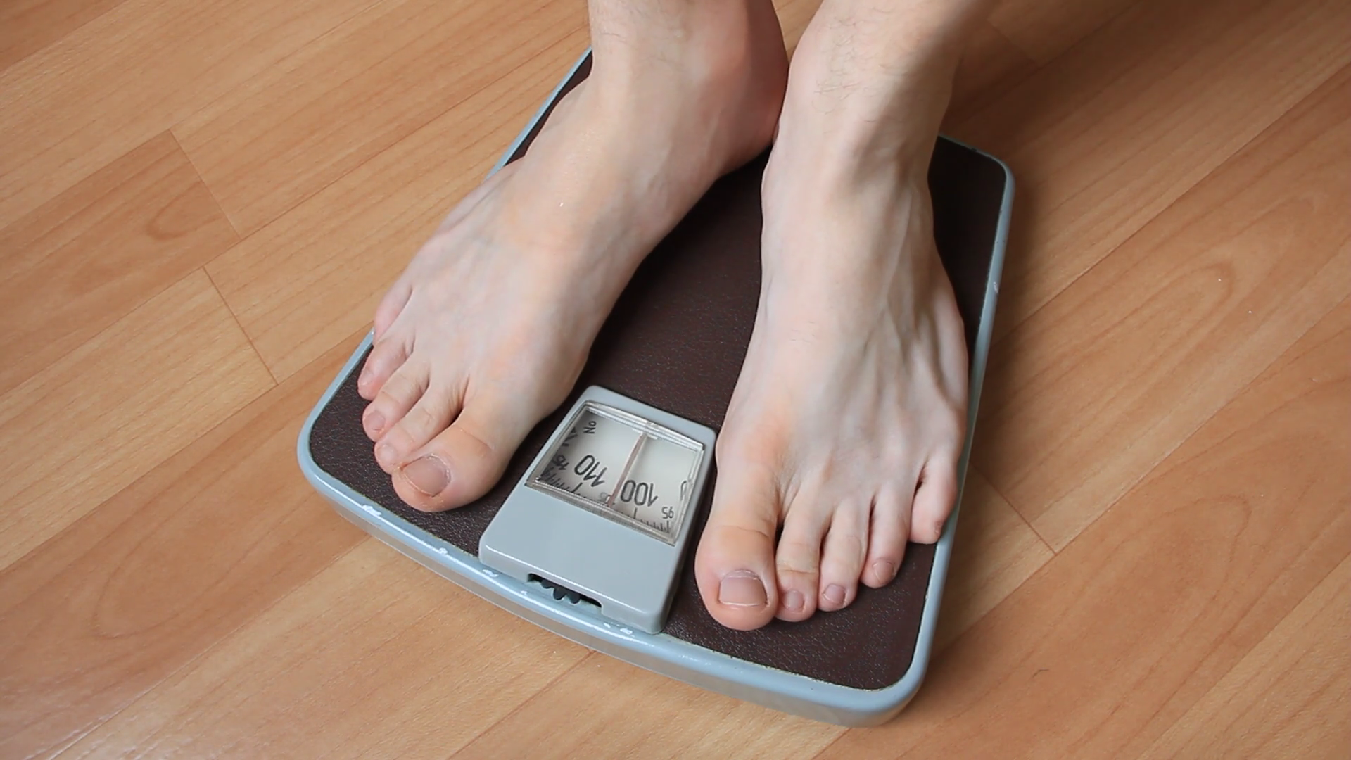 Weight check. Man weights one hundred kilogram Stock Video Footage ...