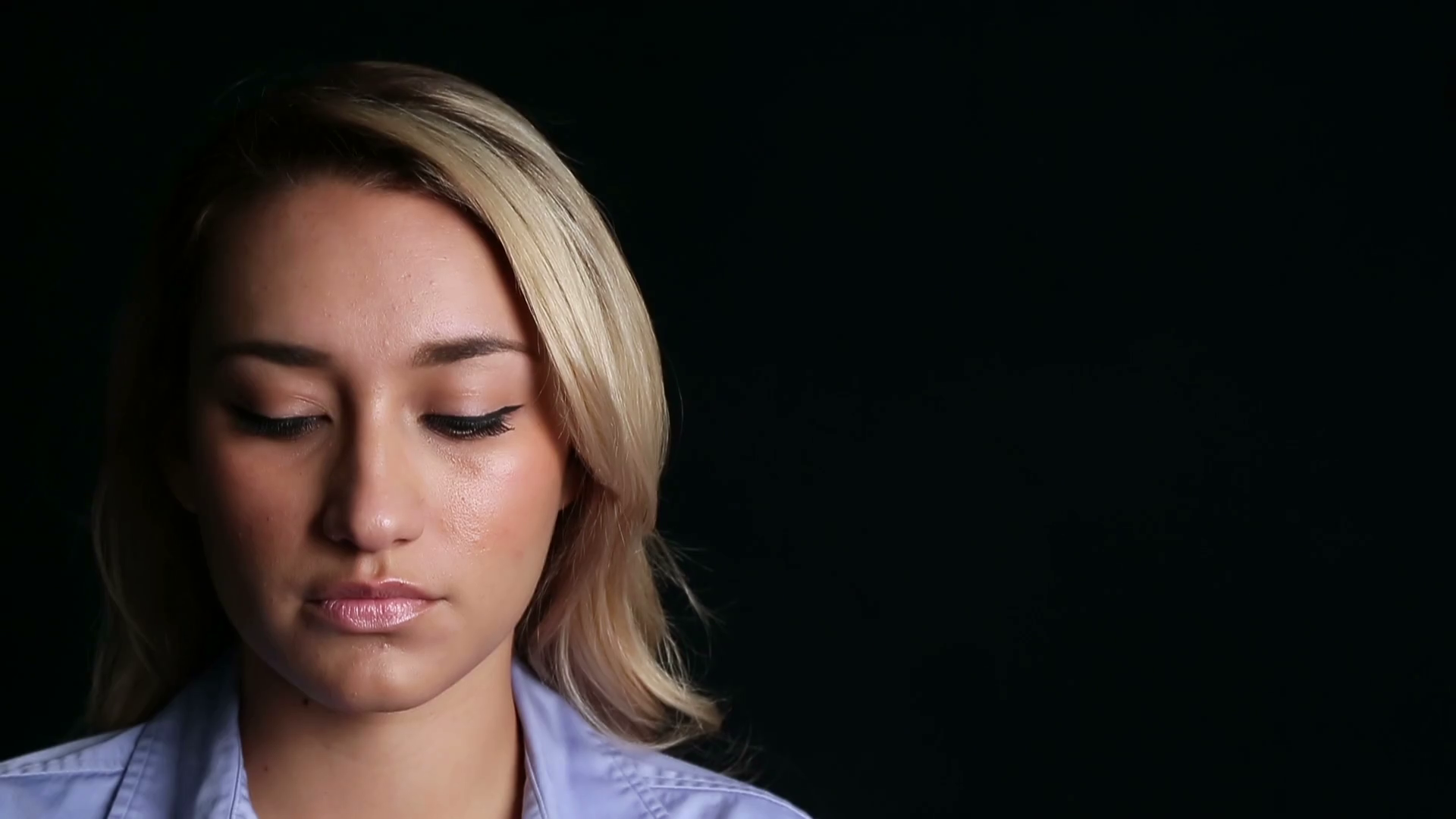 Introspective Young Woman Gazes At Camera Stock Footage SBV-304832050 ...